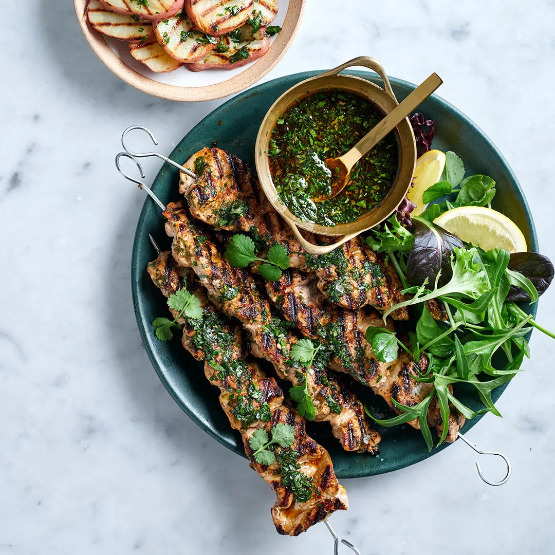 Pork skewers with chimichurri recipe served with grilled potatoes ...