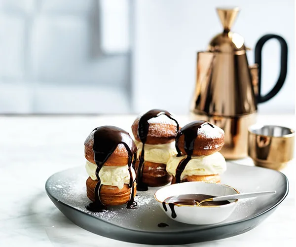 Ice-cream beignet sandwiches with chocolate sauce | Gourmet Traveller