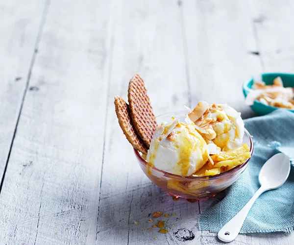 Coconut sundae with pineapple caramel and macadamia nuts recipe ...