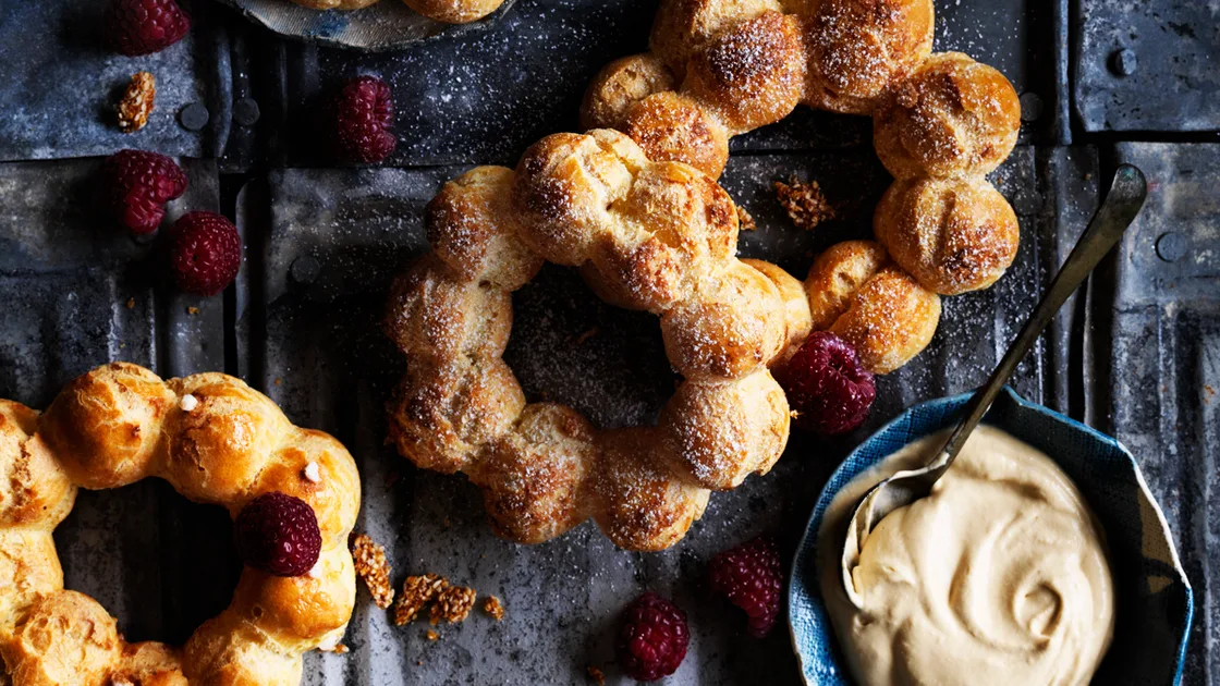 Choux wreaths with burnt-honey cream, raspberries and sesame praline ...