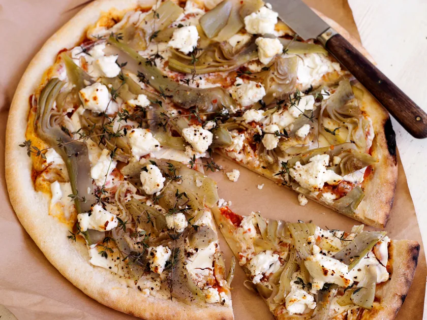 Fresh artichoke pizza with caramelised onions and crumbed goat's cheese ...