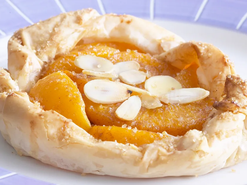 Peach and almond free-form tarts