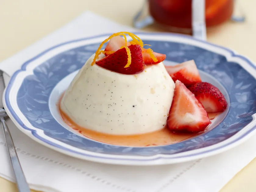 Panna cotta with poached strawberries
