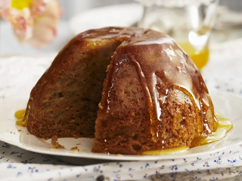 Spicy pear steamed pudding with orange syrup