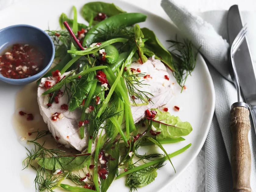 Poached fish fillets with herb and pea salad