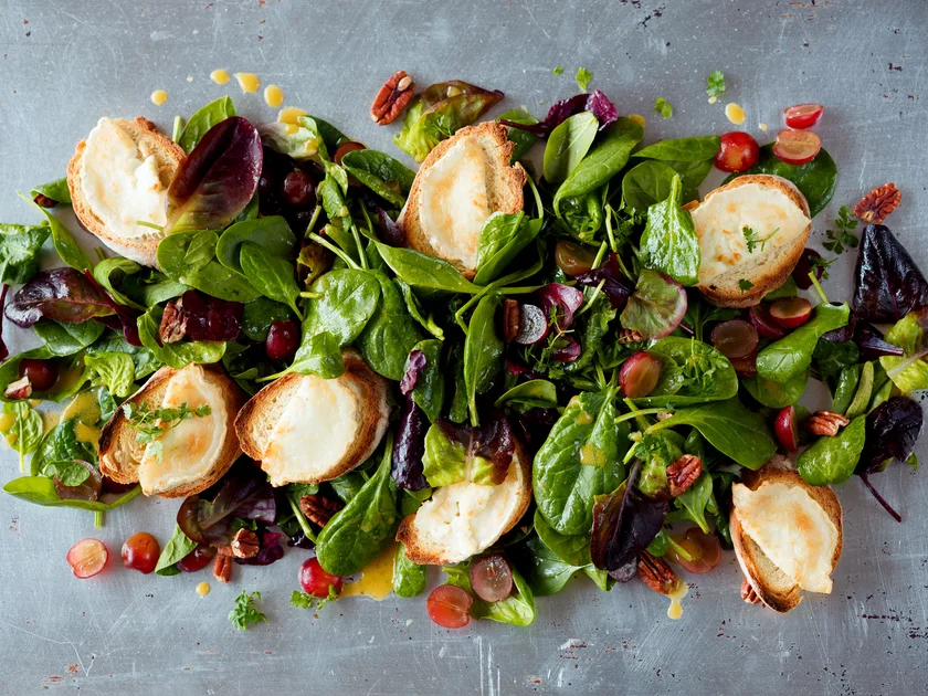 Toasted goat’s cheese with grapes, pecans and summer greens