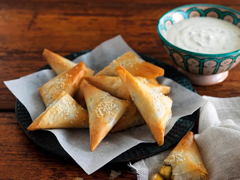Kumara samosas with yoghurt and mint dressing