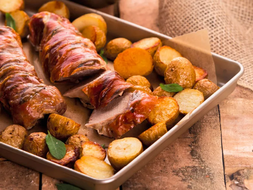 Pork fillet with sage and mascarpone sauce and little roasters