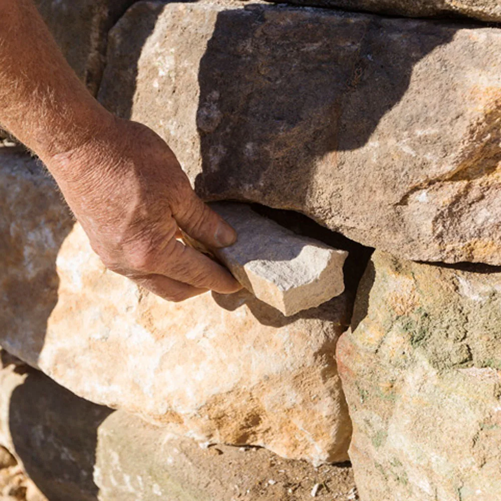 How to build a stacked sandstone wall | Better Homes & Gardens Australia