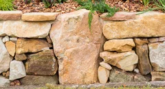How to build a stacked sandstone wall | Better Homes & Gardens Australia