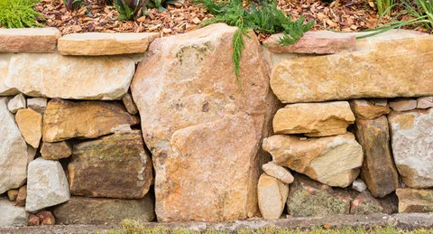 How to build a stacked sandstone wall | Better Homes & Gardens Australia