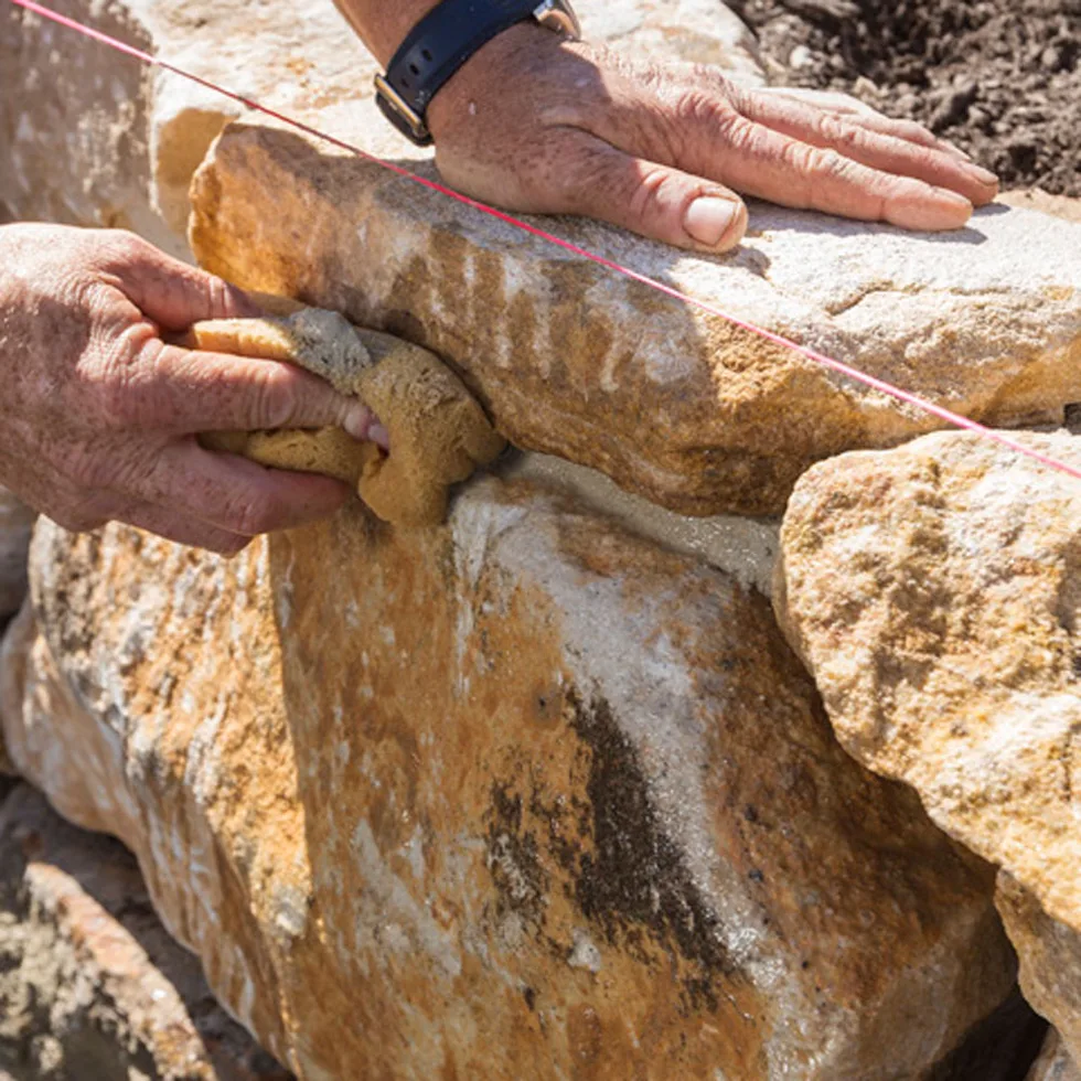 How to build a stacked sandstone wall | Better Homes & Gardens Australia