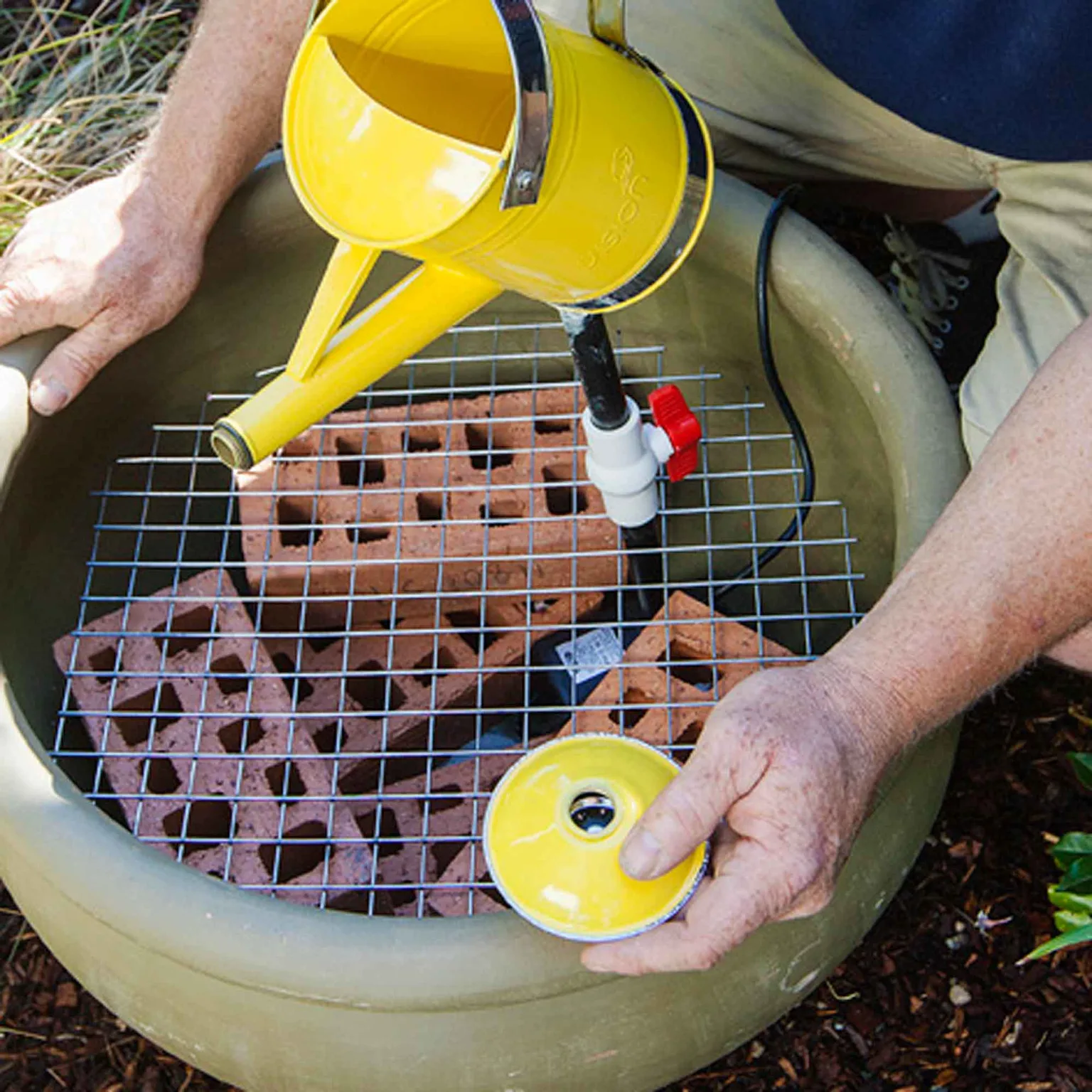 Make your own adorable watering can fountain - Better Homes & Gardens ...