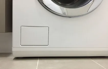 What the little door on a front load washing machine is for