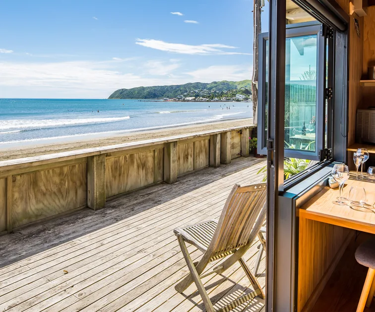 A tiny blue Wellington boatshed for sale is your answer to seaside living