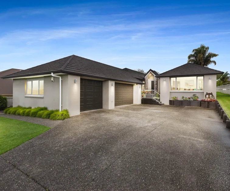 This sun-drenched Pukekohe family home comes with a pool