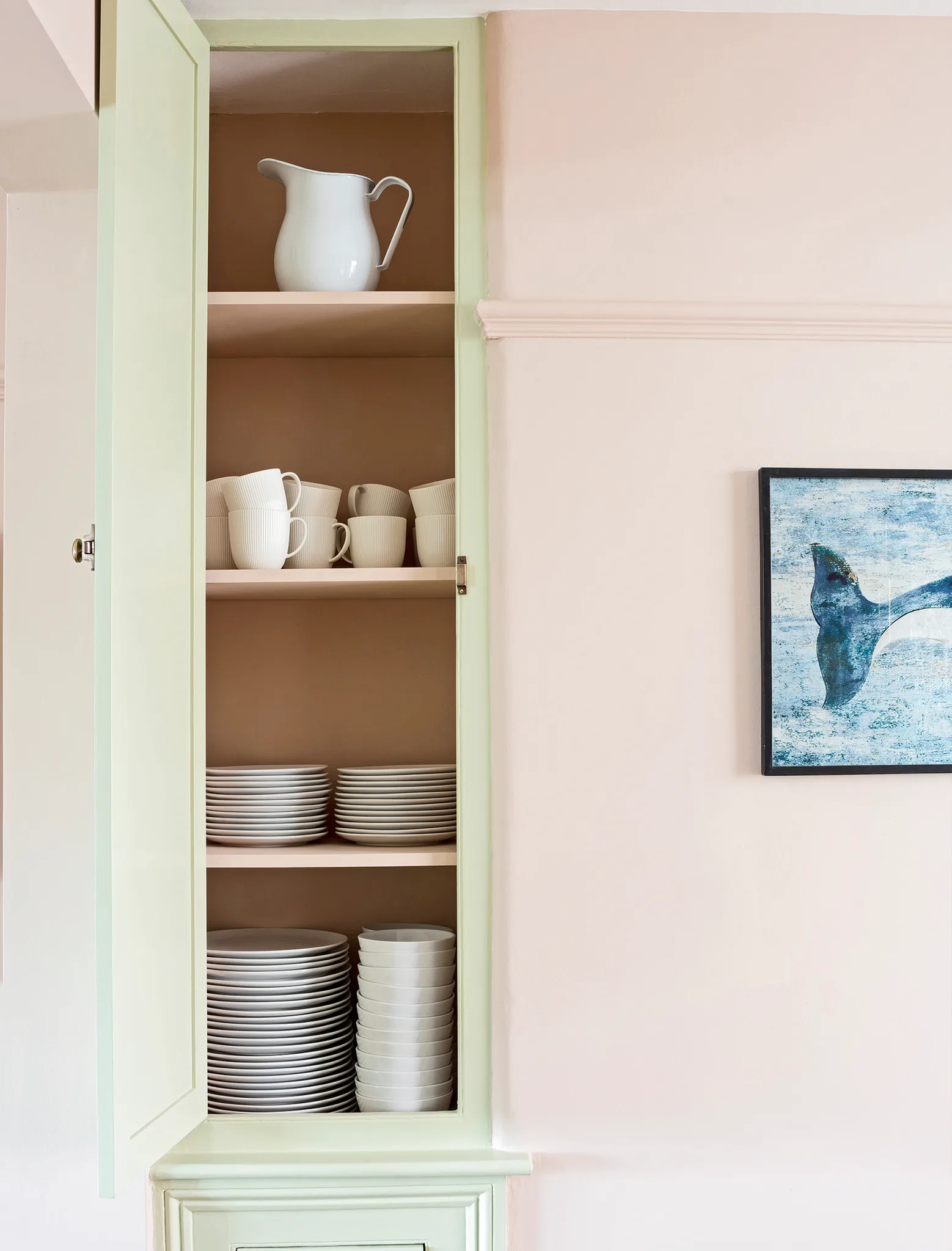 A charming seaside cottage awash with pretty pastel hues