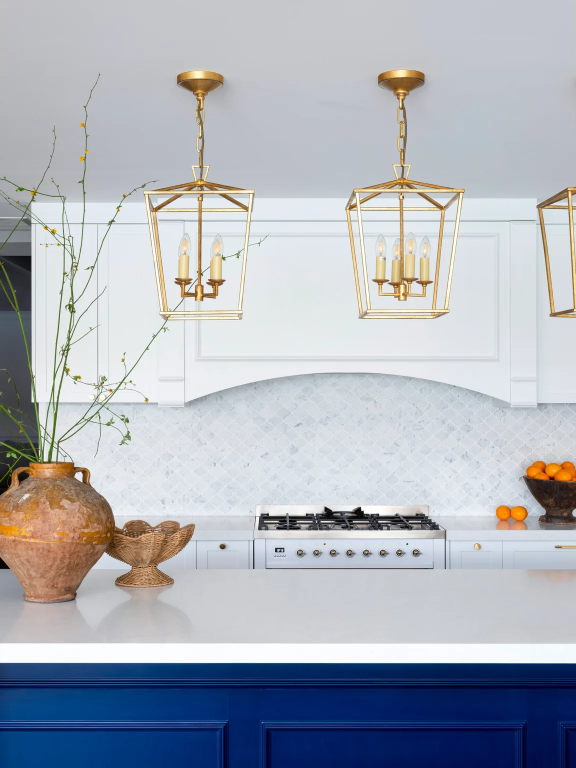 A classic Hampton's kitchen with a bold blue island | Home Beautiful