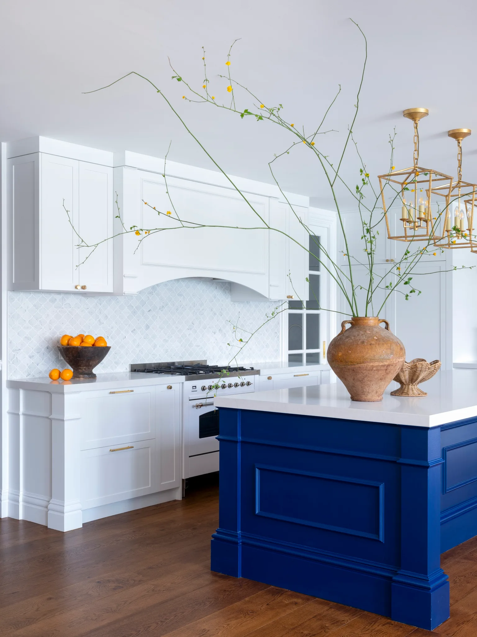 A classic Hampton's kitchen with a bold blue island | Home Beautiful