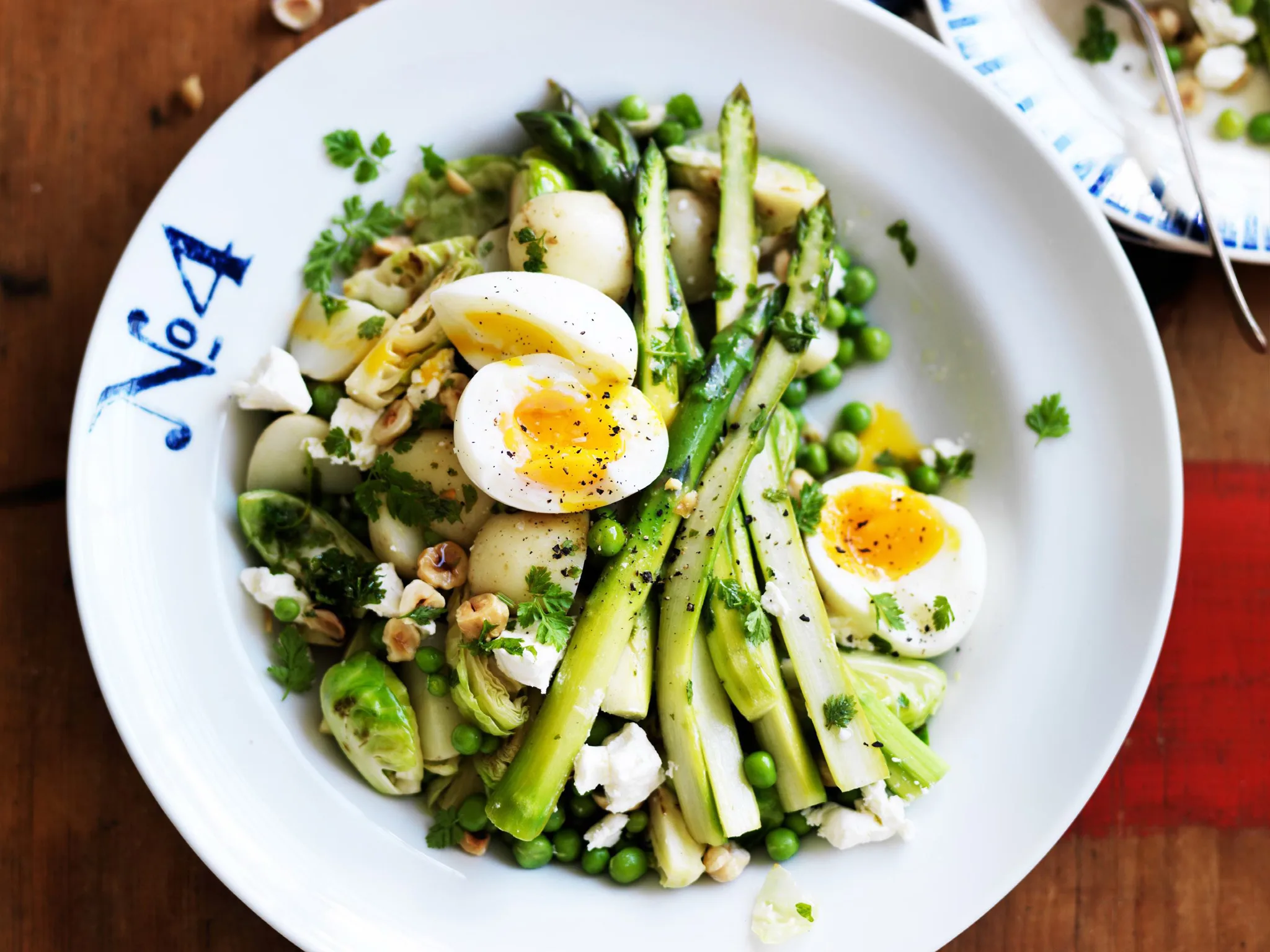 Warm Green Salad with Soft Eggs and Hazelnut Dressing