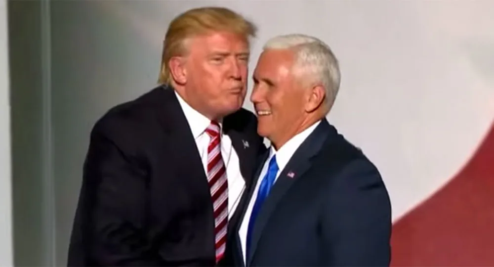 Donald Trump Awkwardly Kisses Mike Pence On Stage | marie claire