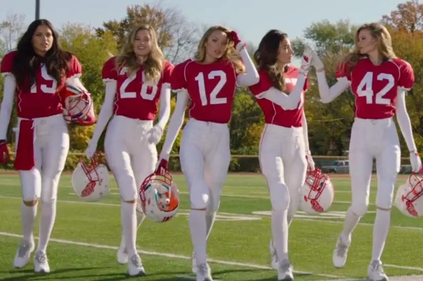 Watch Victorias Secret Angels play football.