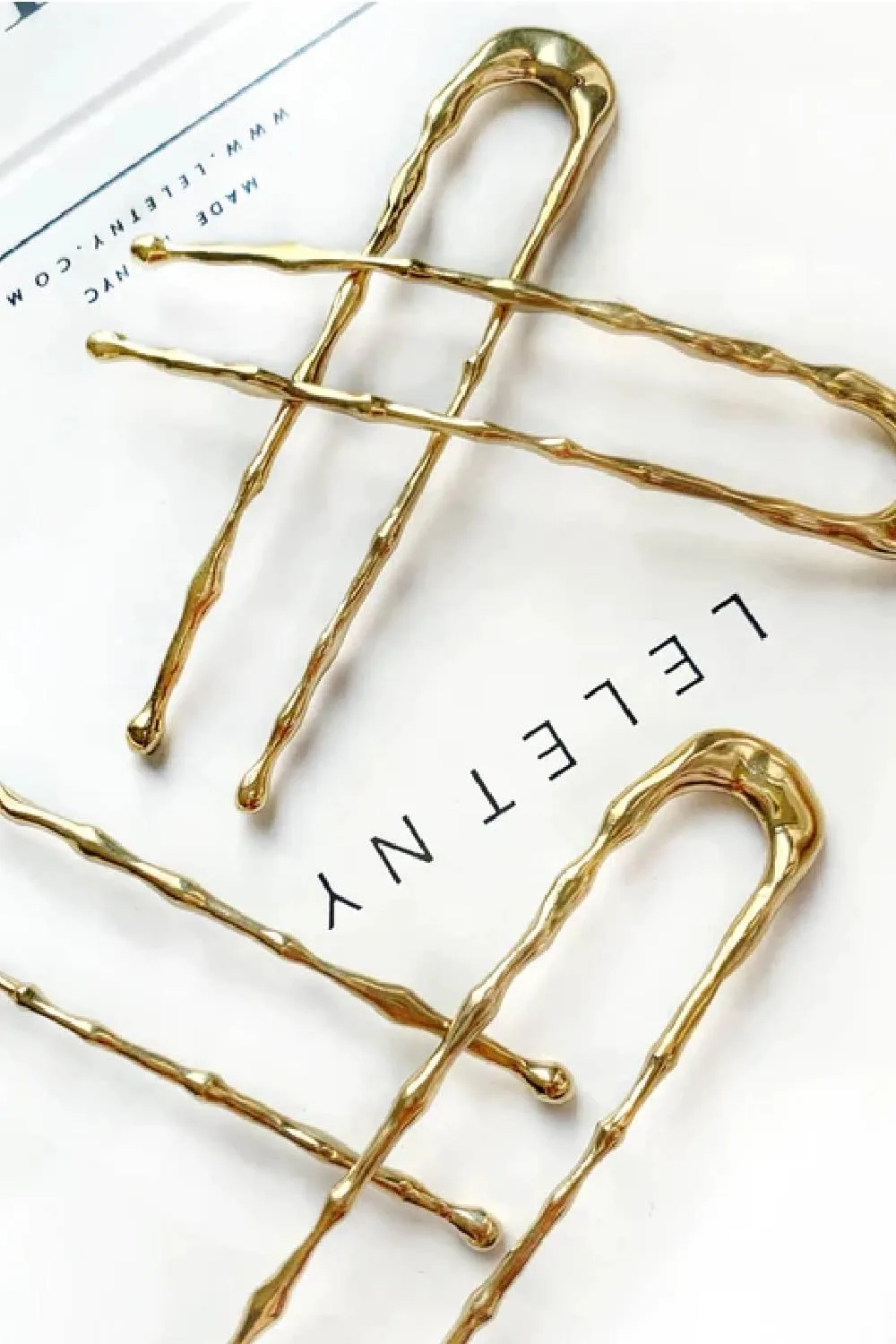 How to Use the French Pin: Tips & Hairstyles to Try | ELLE