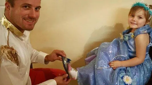 Doting dad takes daugther to Cinderella dressed as Prince Charming