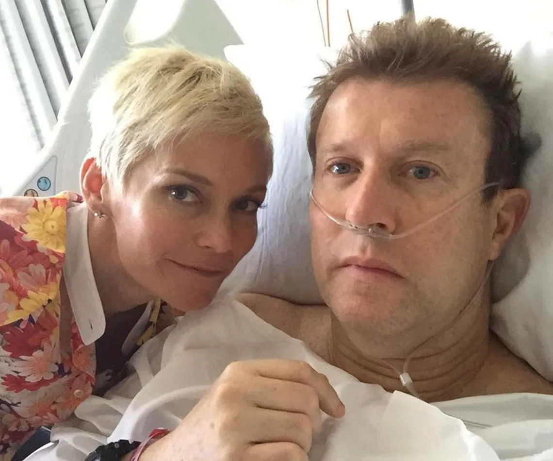 Peter Overton is comforted by wife after spinal surgery