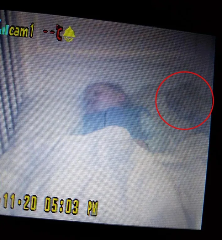 Mum shares photos of a "ghost baby" in bed with son