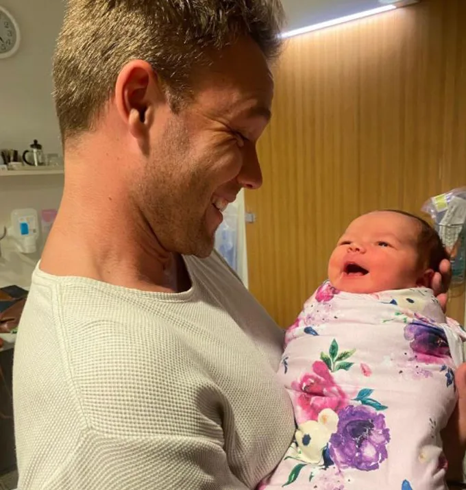 Lincoln Lewis meets his new niece for the fist time