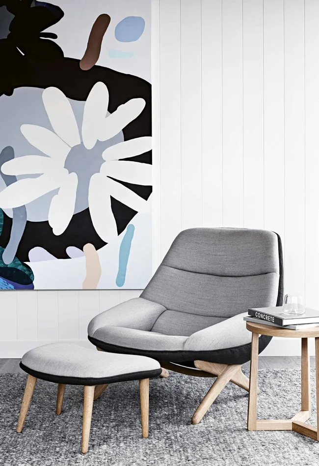 A sleek and modern beach house with a greyscale palette