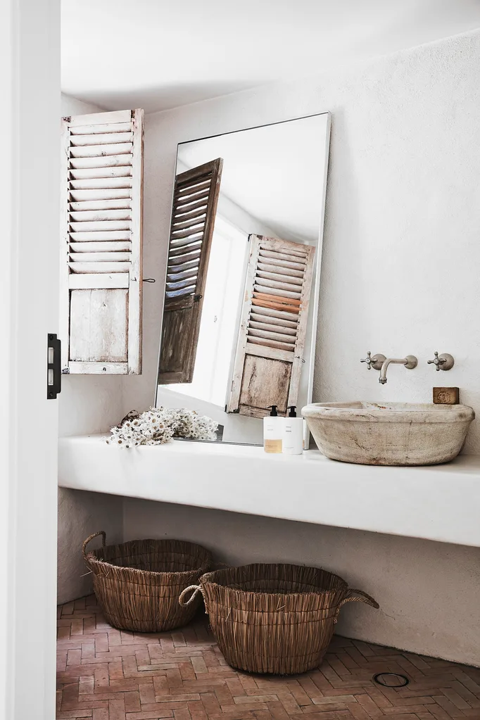 A modern rustic Mediterranean bathroom
