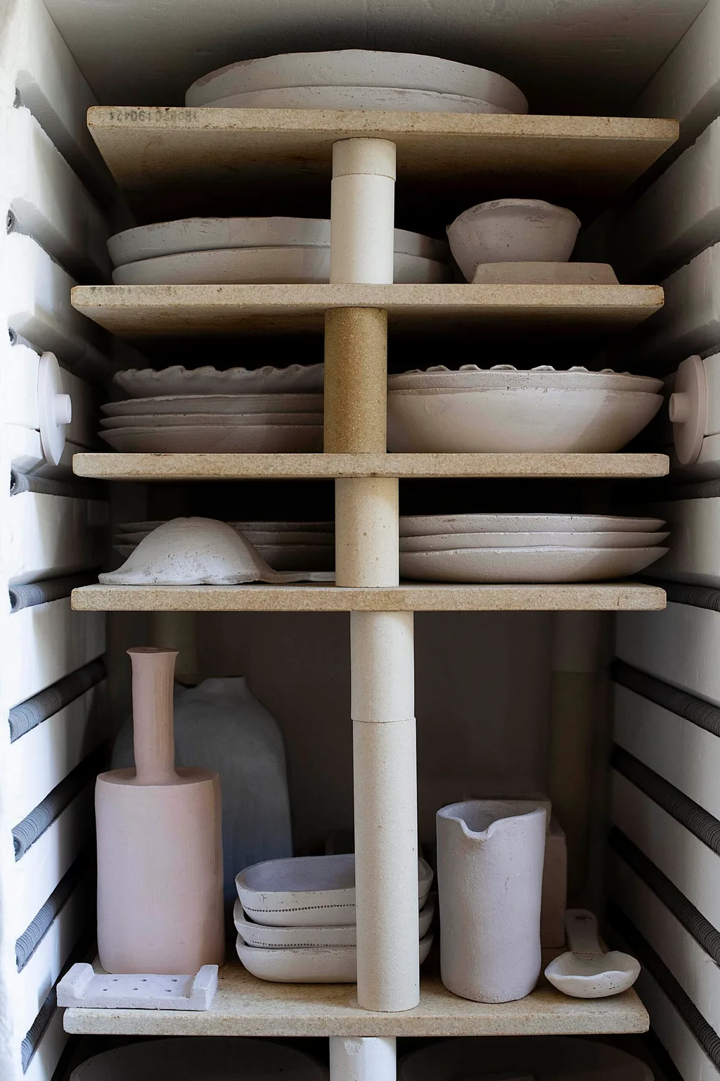 Inside a potter's converted train carriage studio