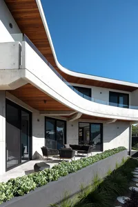 Tour a striking X-shaped home that functions around family