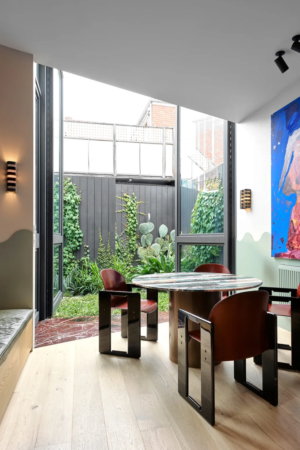 A compact home bursting with colour and clever design